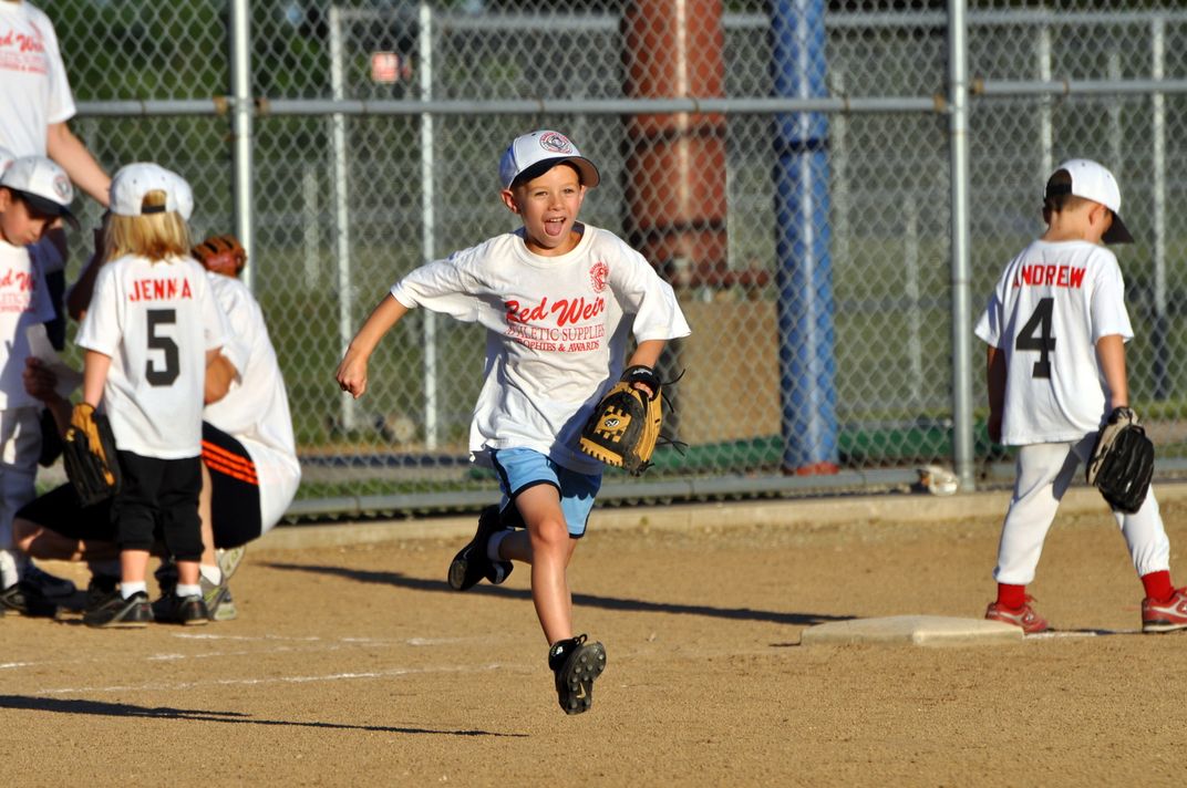 Logan races to take his position in the outfield | Smithsonian Photo ...