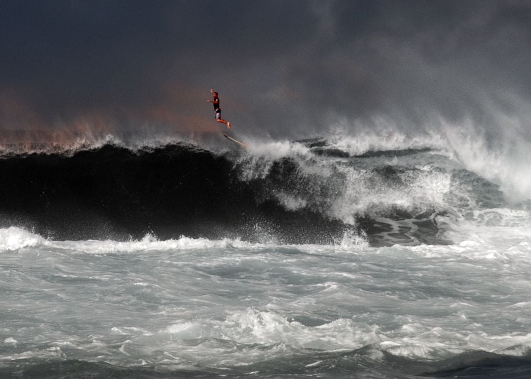 Surfer being thrown from big wave on North Shore of Oahu in Hawaii ...