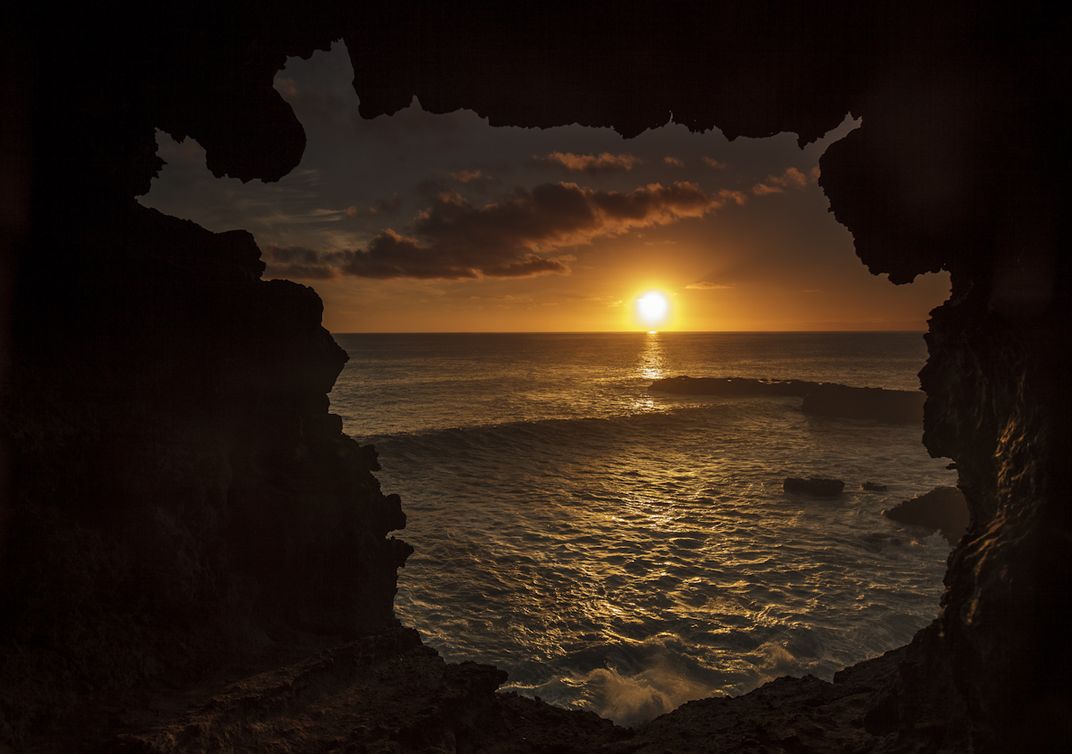 Enjoying the sunset inside a lava cave. | Smithsonian Photo Contest ...