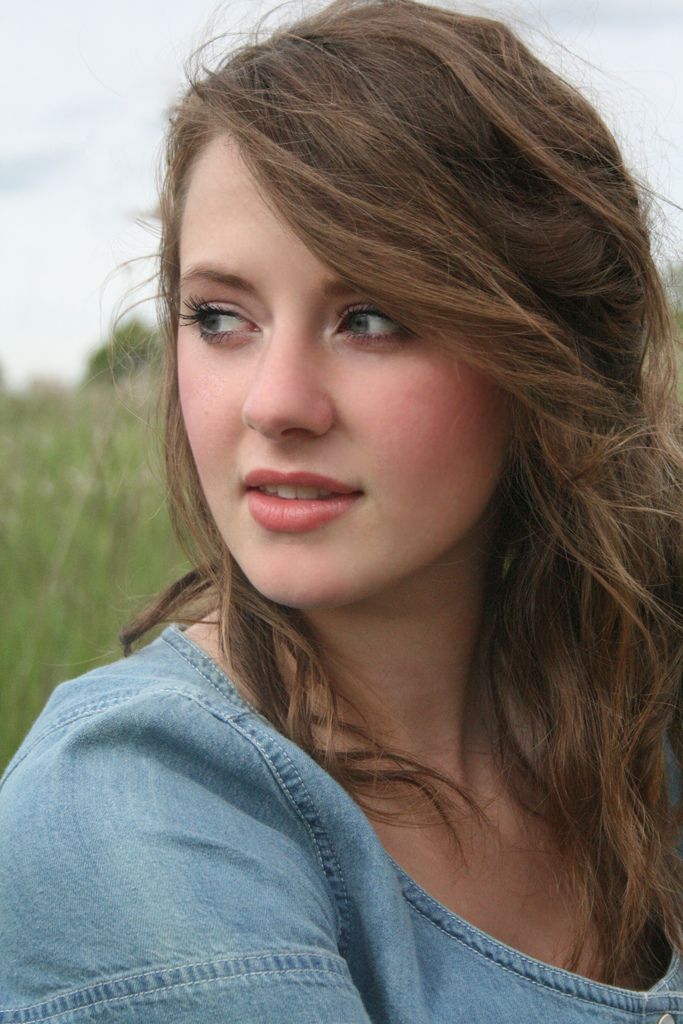 My friend Sarah, a beautiful, all-American girl, in a meadow in metro ...