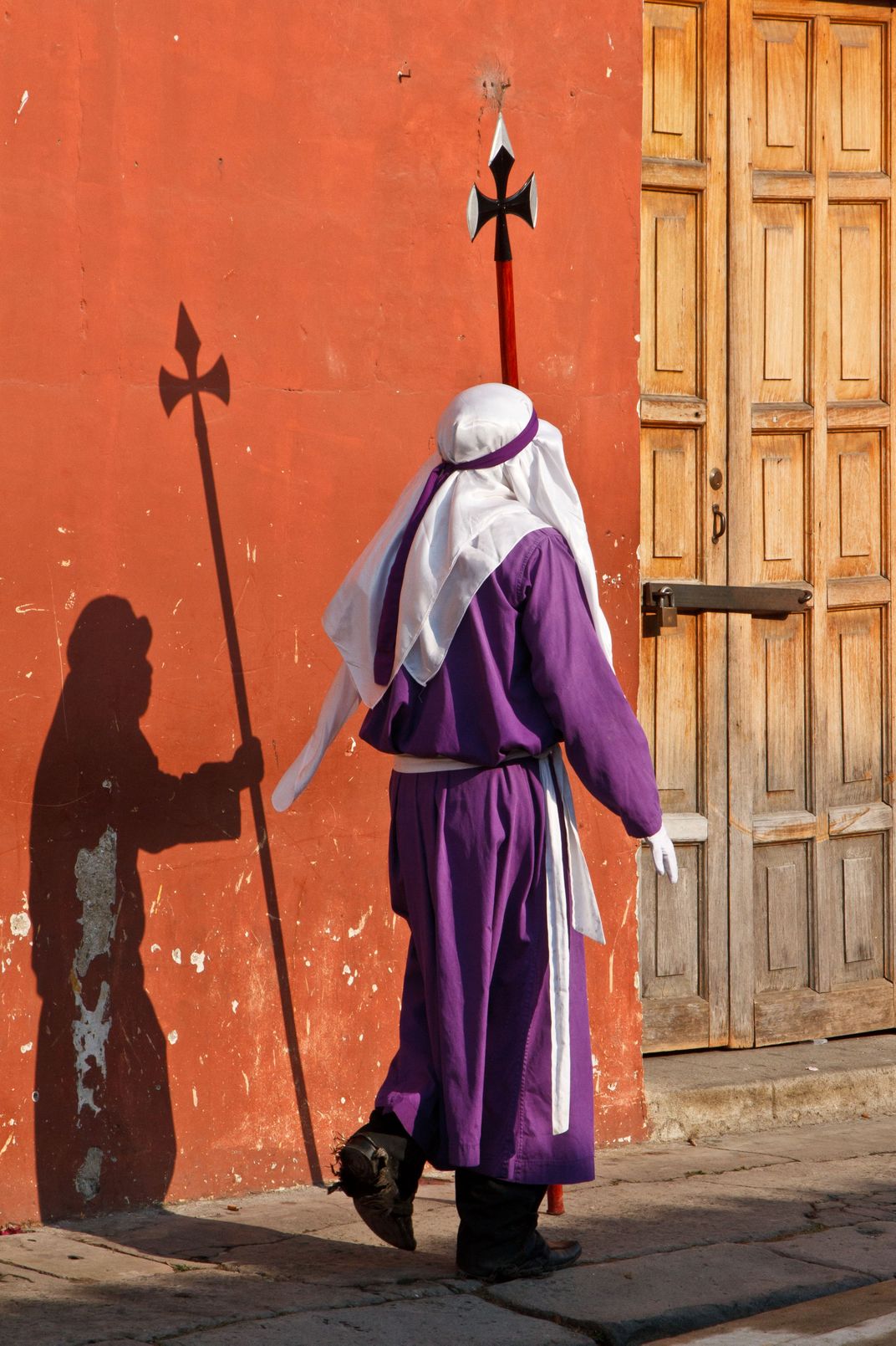 Member of a religious Brotherhood on his way to an Easter procession ...