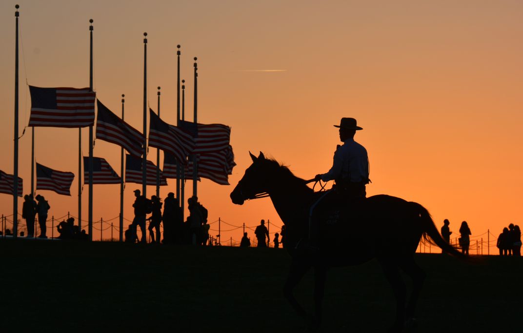 mounted police riding at sunset over Washington dc park | Smithsonian ...