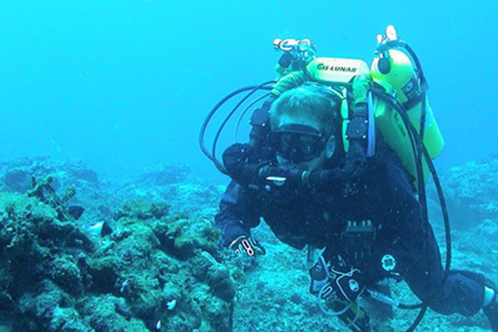 man diving underwater