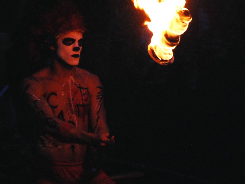 The Caddo Chief carries his torch during tribal initiation for kids at ...