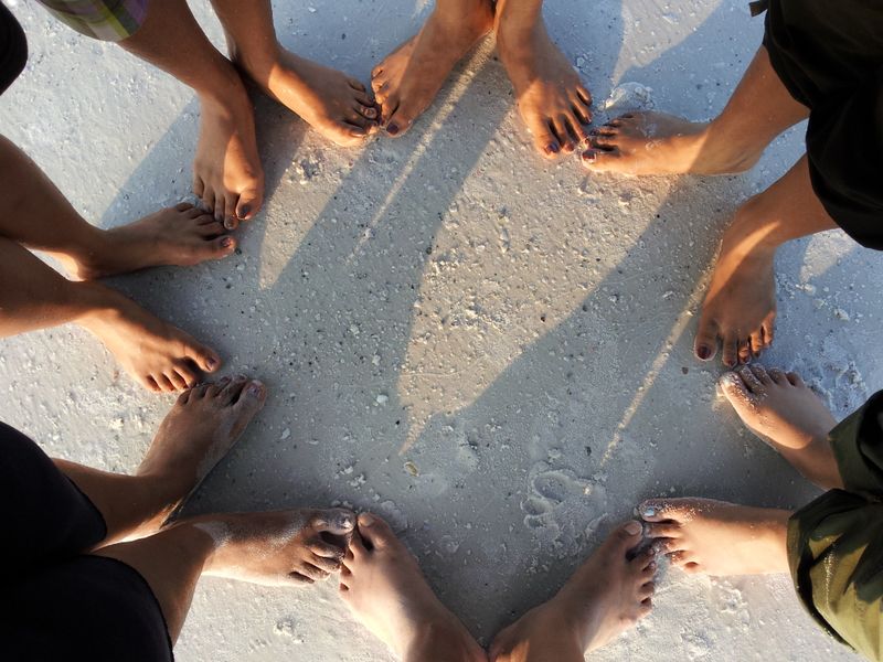 Closed circle feet... they belong to different people comming from ...