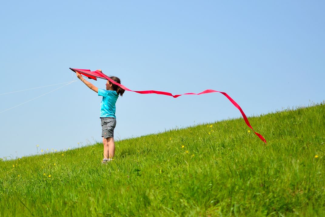 Girl with red kite | Smithsonian Photo Contest | Smithsonian Magazine