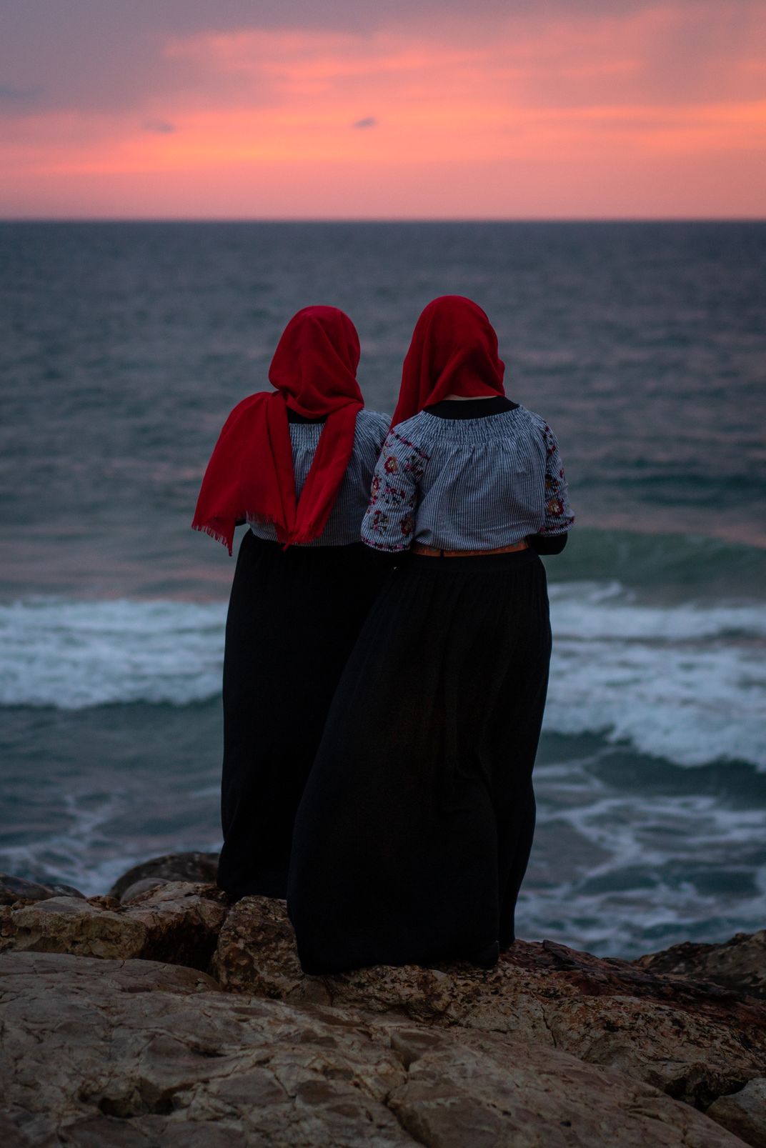 Sisters watch a sunset in Jaffa, Israel | Smithsonian Photo Contest ...