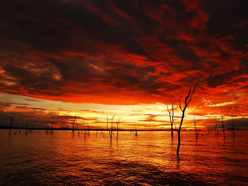 Taken on a boat at sunset on Lake Kariba in Zimbabwe, showing the ...
