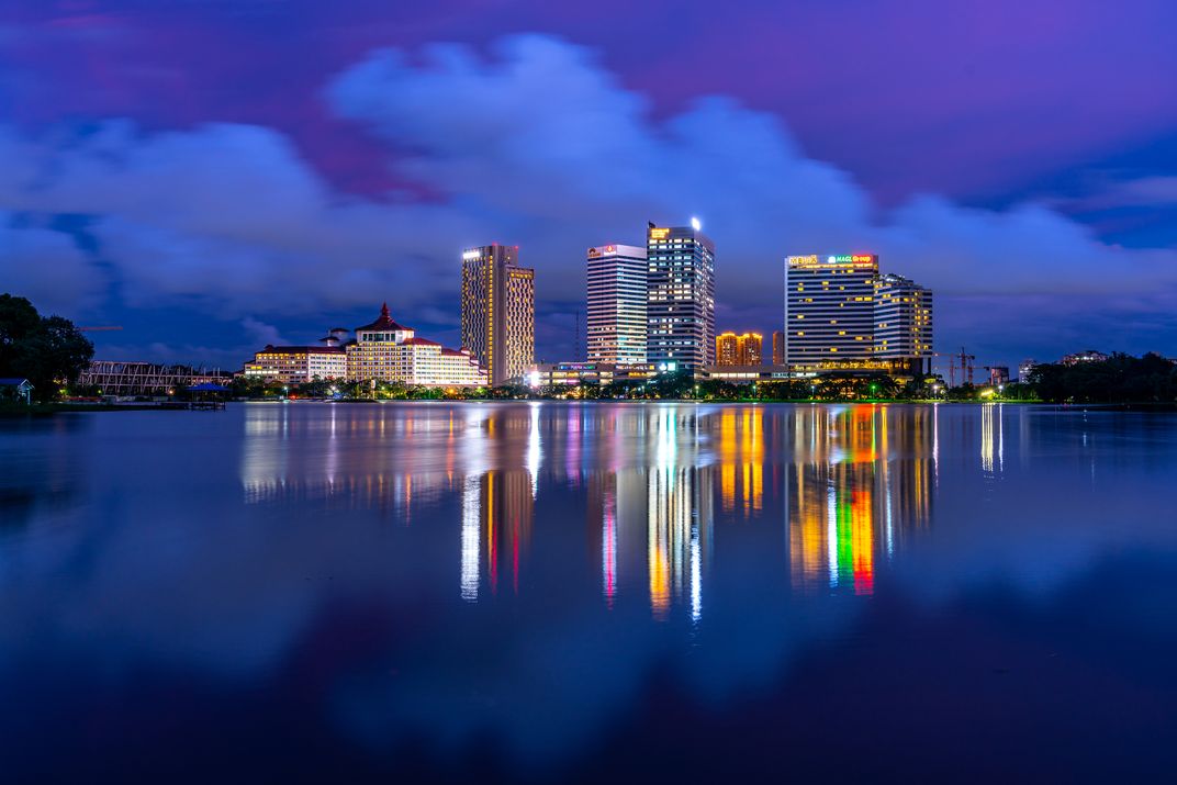 The reflection and moving clouds at yangon city | Smithsonian Photo ...