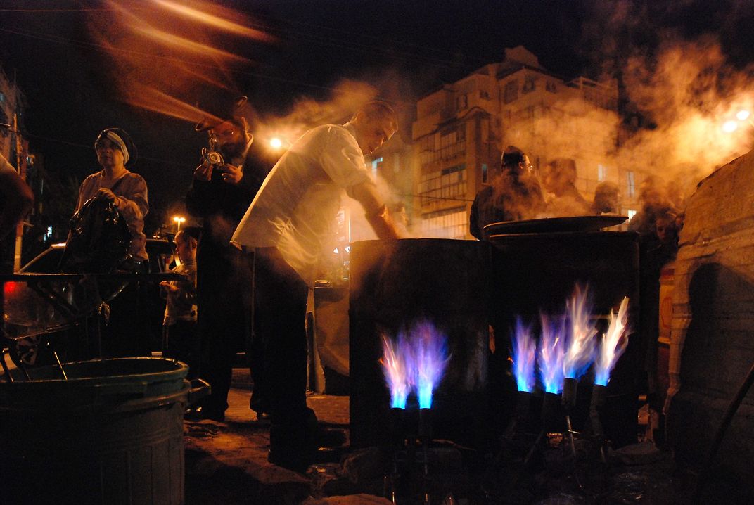 A religious ritual of cleansing kitchenware in boiling water, in the ...