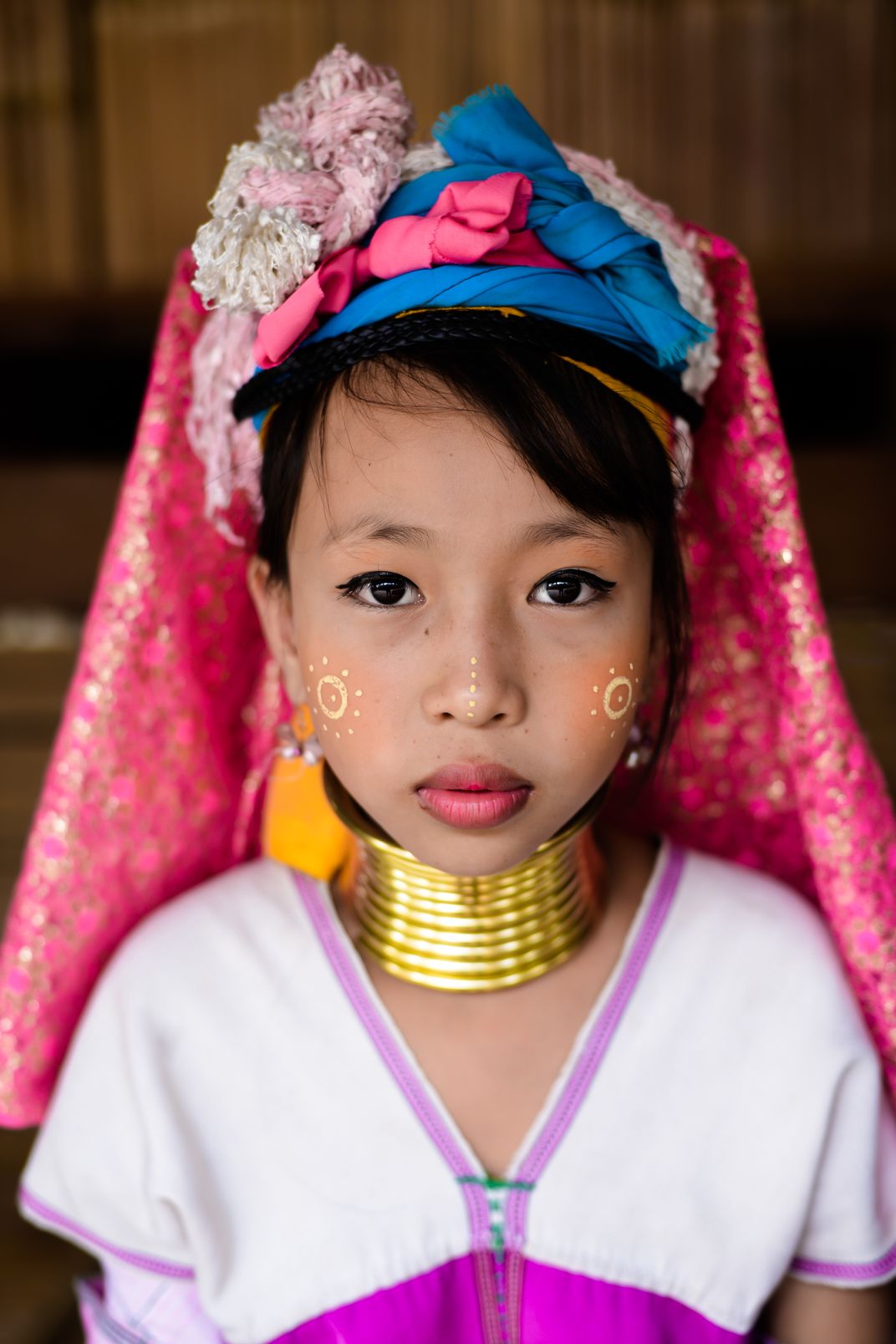 A long neck child girl, belonging to the hill tribes who are Burmese ...