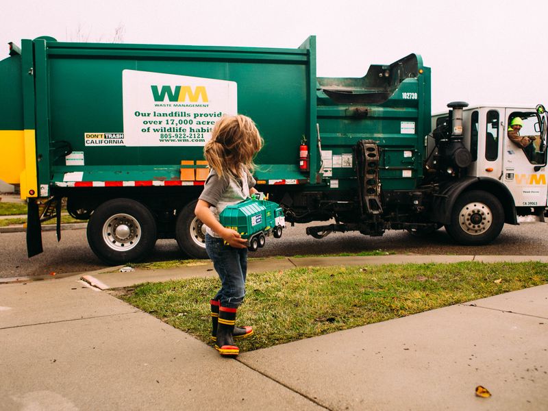 A boys obsession with the garbage truck | Smithsonian Photo Contest ...