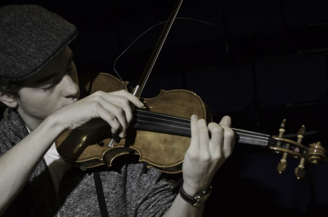 Philip Elias Carter performs violin on Stony Brook University's main ...