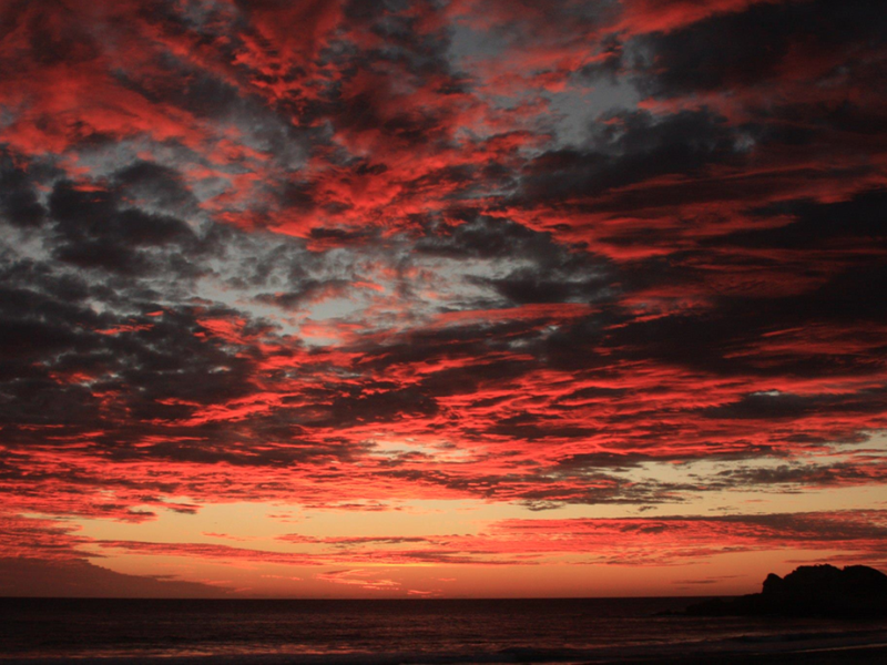 Dramatic red sunset at the land of fertility in this amazing coast of ...