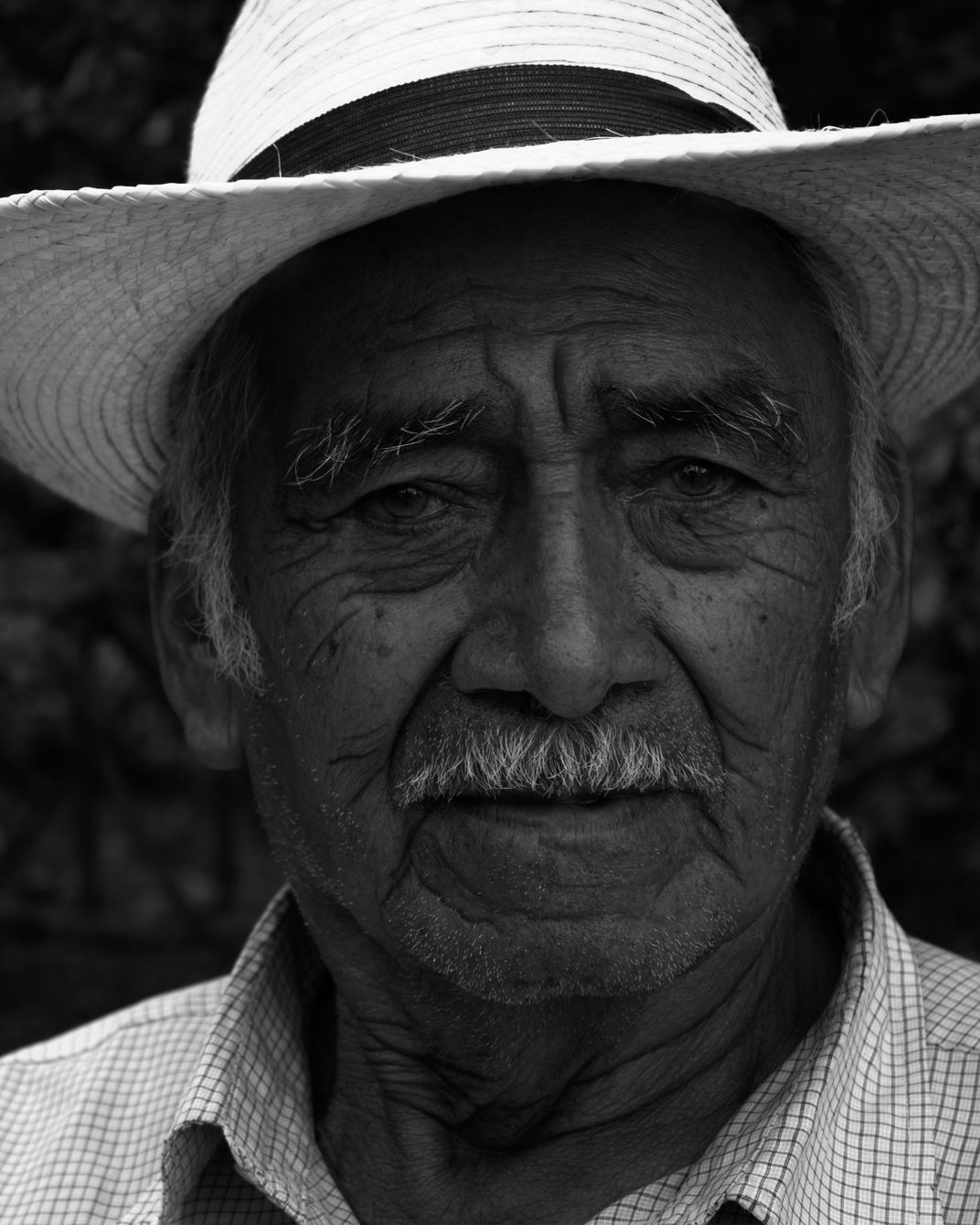 An old, elegant man at the Central Park of Antigua Guatemala ...