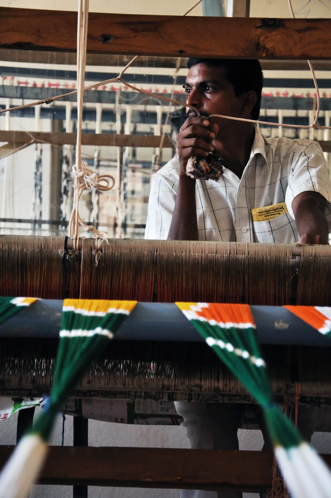 An employee at a weaver's cooperative outside Hyderabad, India. The ...