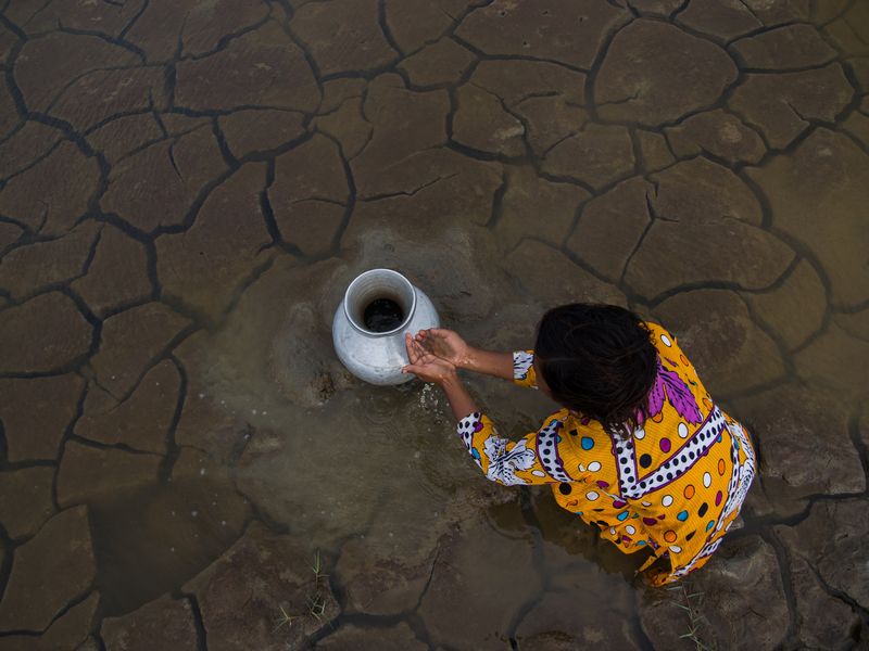 A village girl collecting the drinking water. its like a daily routine ...