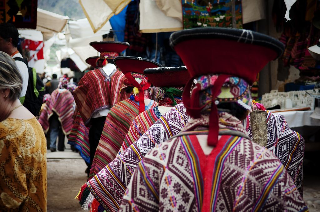 Peruvians wearing traditional Incan clothing entertain tourists at the ...