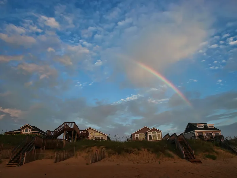 Along the beach at sunrise in Duck, North Carolina, located on the ...