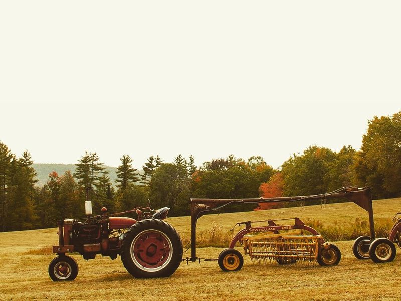 A tractor in a hay field | Smithsonian Photo Contest | Smithsonian Magazine