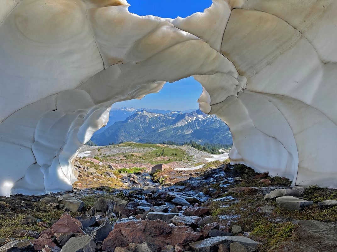 Snowy arch framing the Tatoosh Range in Mt. Rainier National Park ...