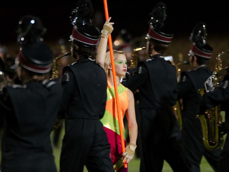 Color guard performer is a splash of color in the ranks of a high ...