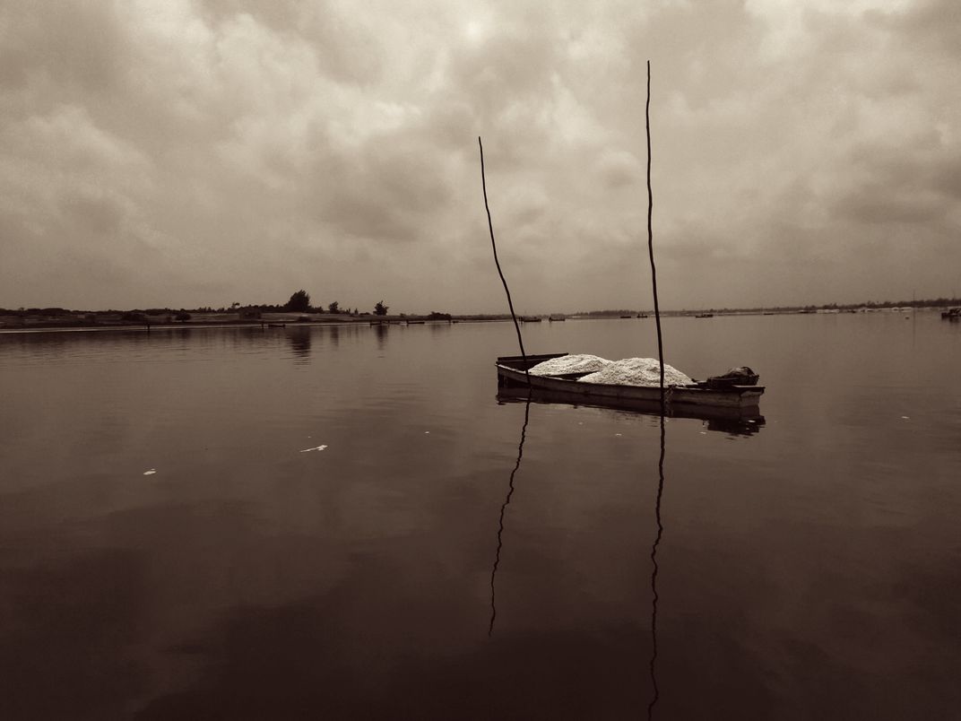 Salt boat on Pink Lake, Senegal. | Smithsonian Photo Contest ...