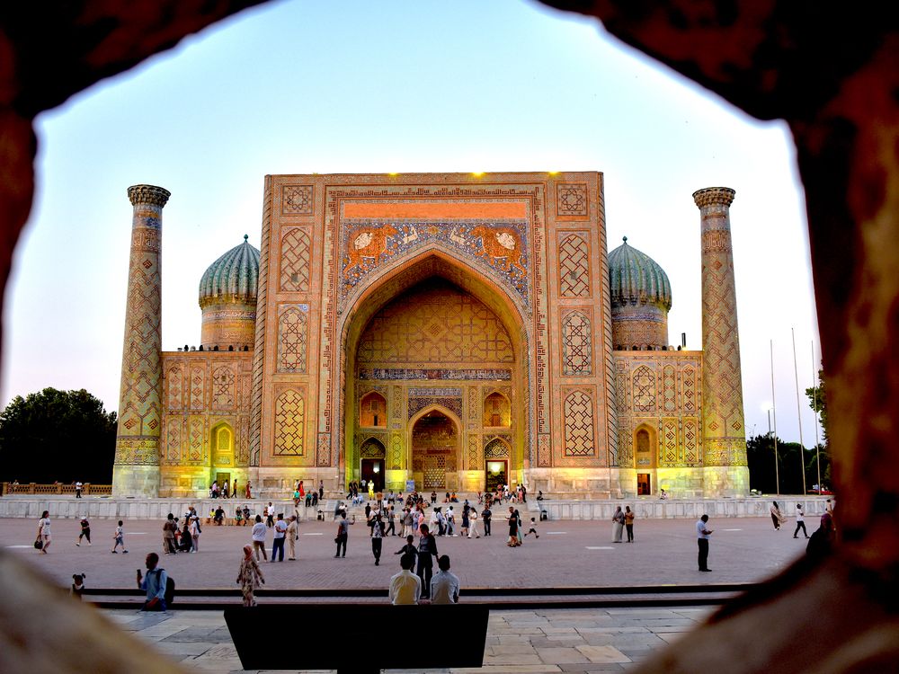 The Ulugh Beg madrasa at nightfall, from the Sher Dor madrasa ...
