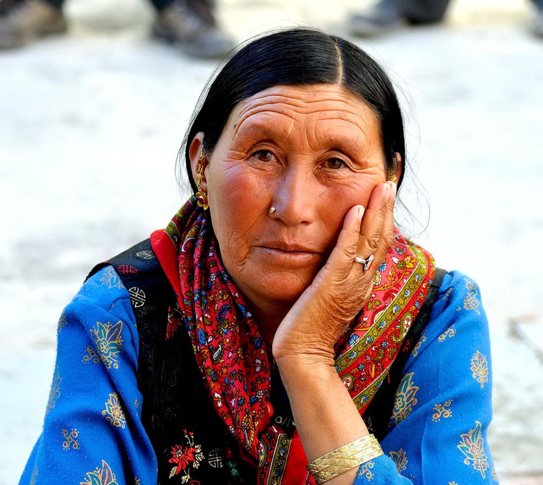 Old lady watches the masked dances at Tabo monastery, Spiti, Himachal ...