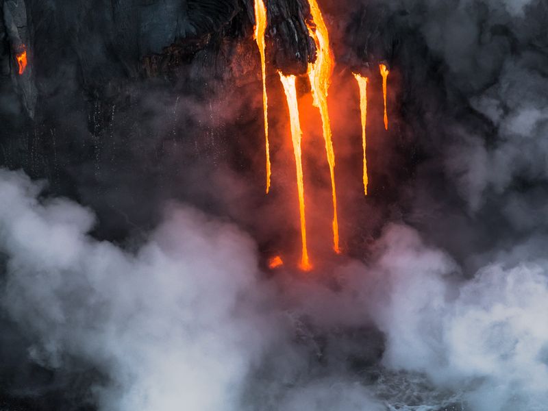 Lava flows into the ocean producing steamy mist | Smithsonian Photo ...
