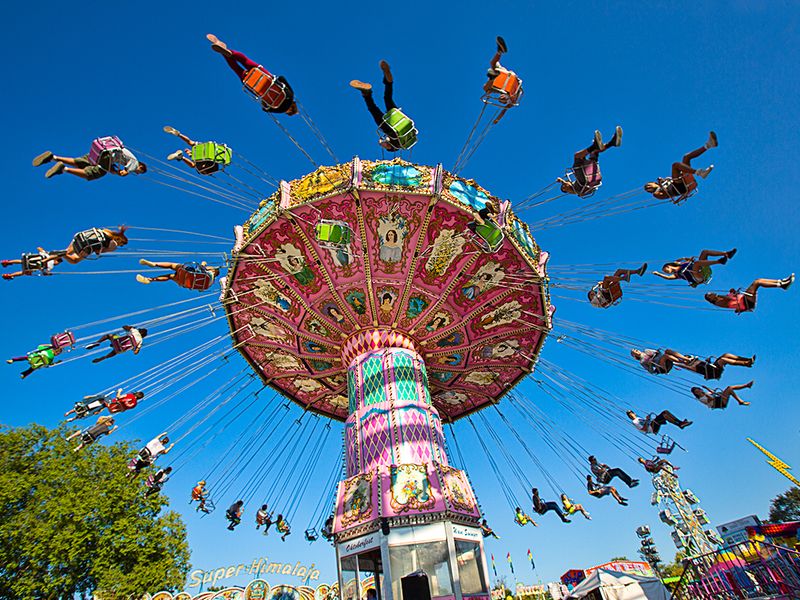 This is a photo of people on the Wave Swinger ride at the Paso Robles ...