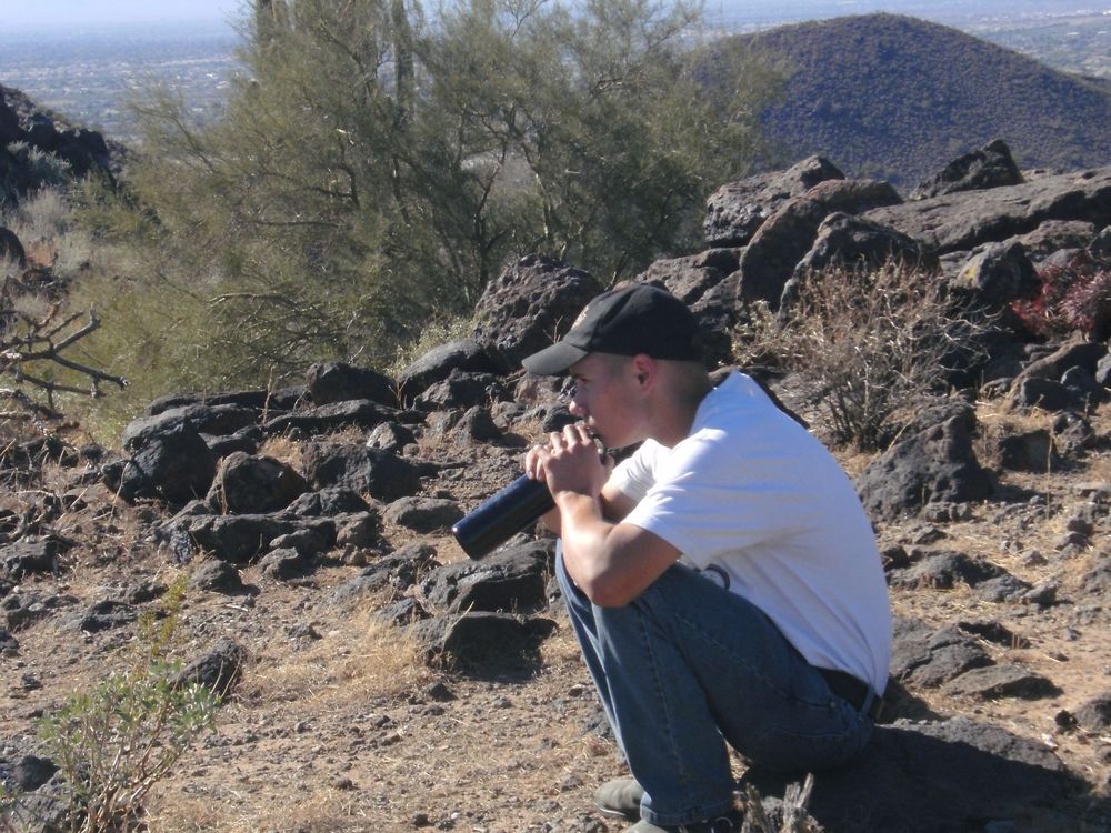 Mathew Porter Fox waiting and reflecting on a trail on Thunderbird ...