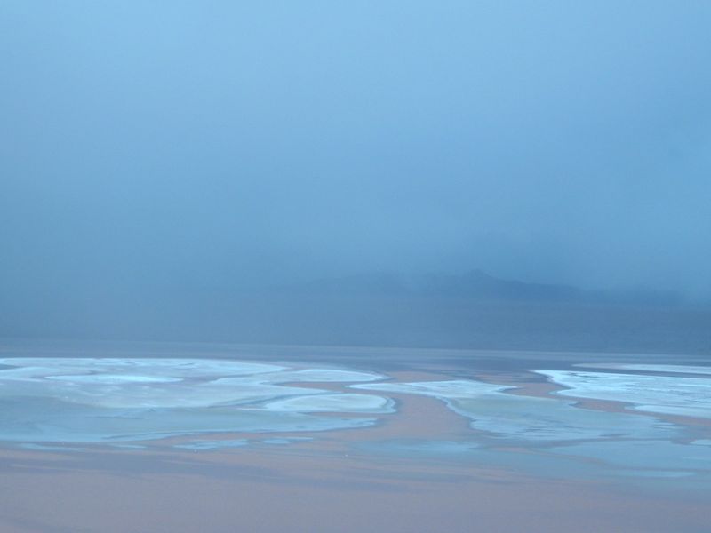 The green lagoon near Salar de Uyuni, Bolivia glistens in the afternoon ...