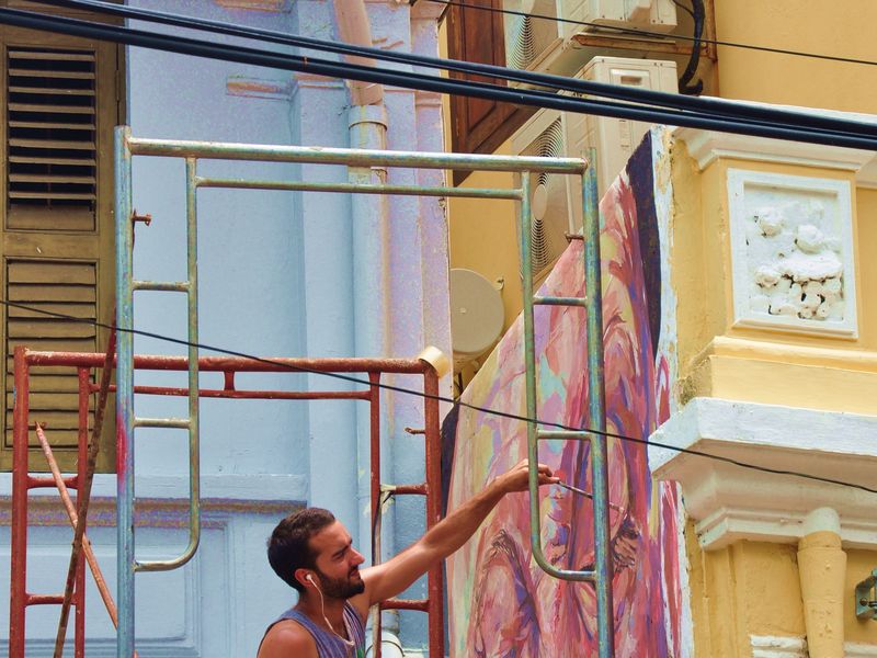 a man painting the graffiti on the wall | Smithsonian Photo Contest ...