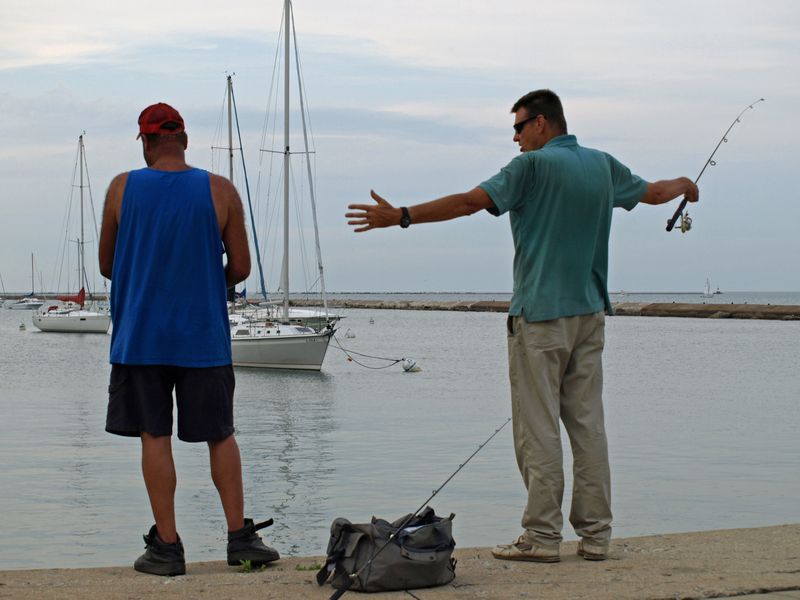 Two fishermen discuss the one that got away. | Smithsonian Photo ...