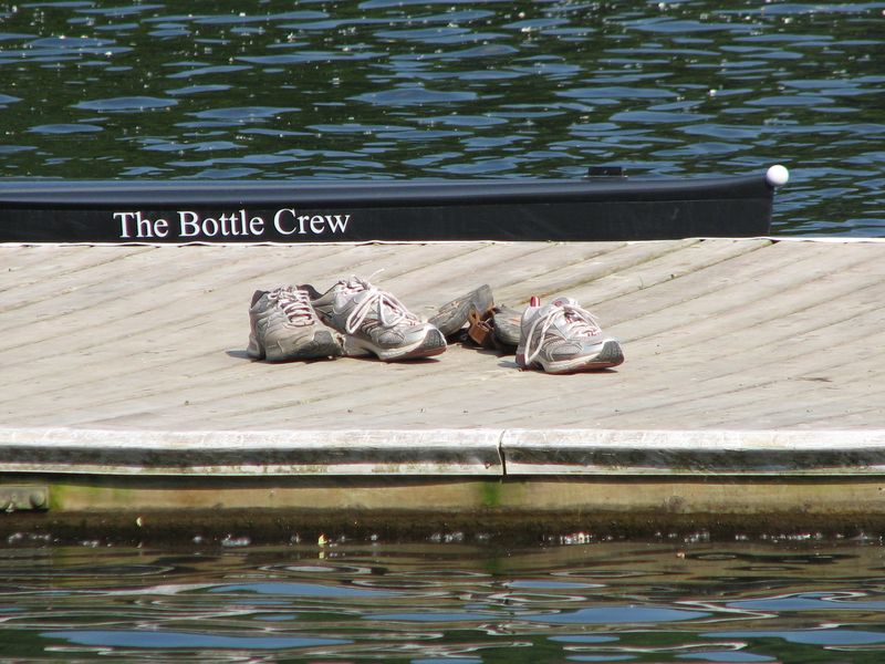 Rowers' shoes sitting on a dock during a regatta. A boat had just ...
