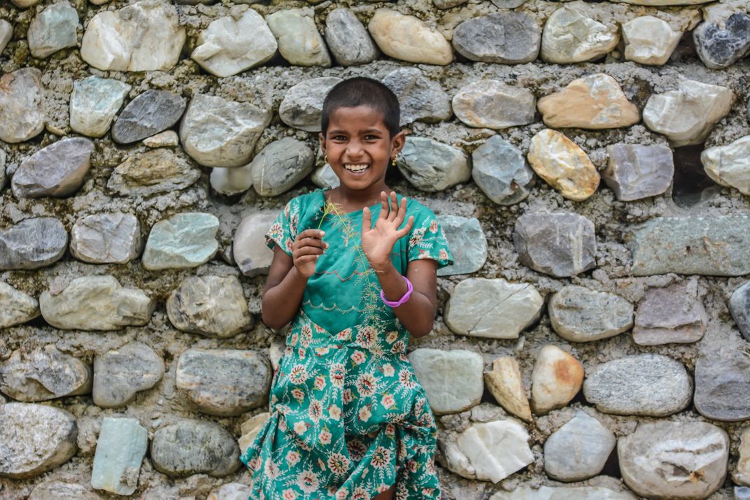 Traveling through Jaigaon, India, I came upon this little girl standing ...
