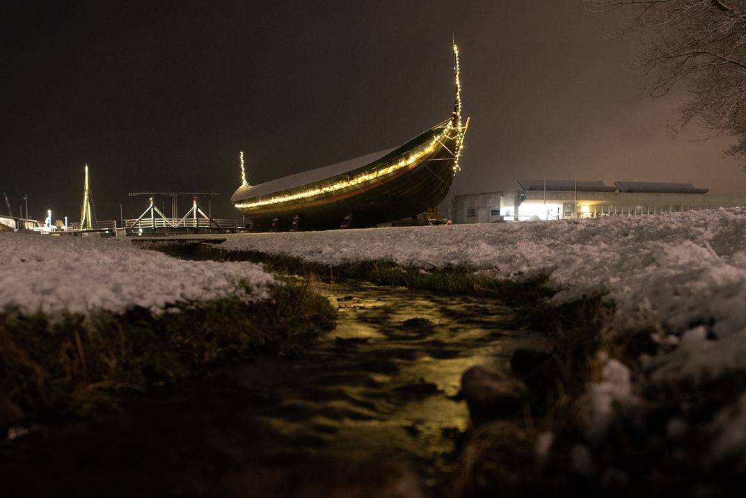 A replica of a vikingship called The Sea Stallion dressed in winter ...