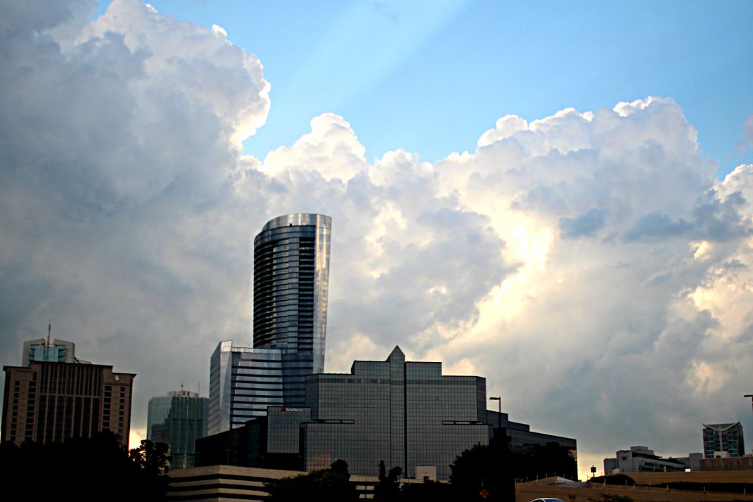 Large cumulus clouds hanging over the middle of Atlanta, Georgia ...