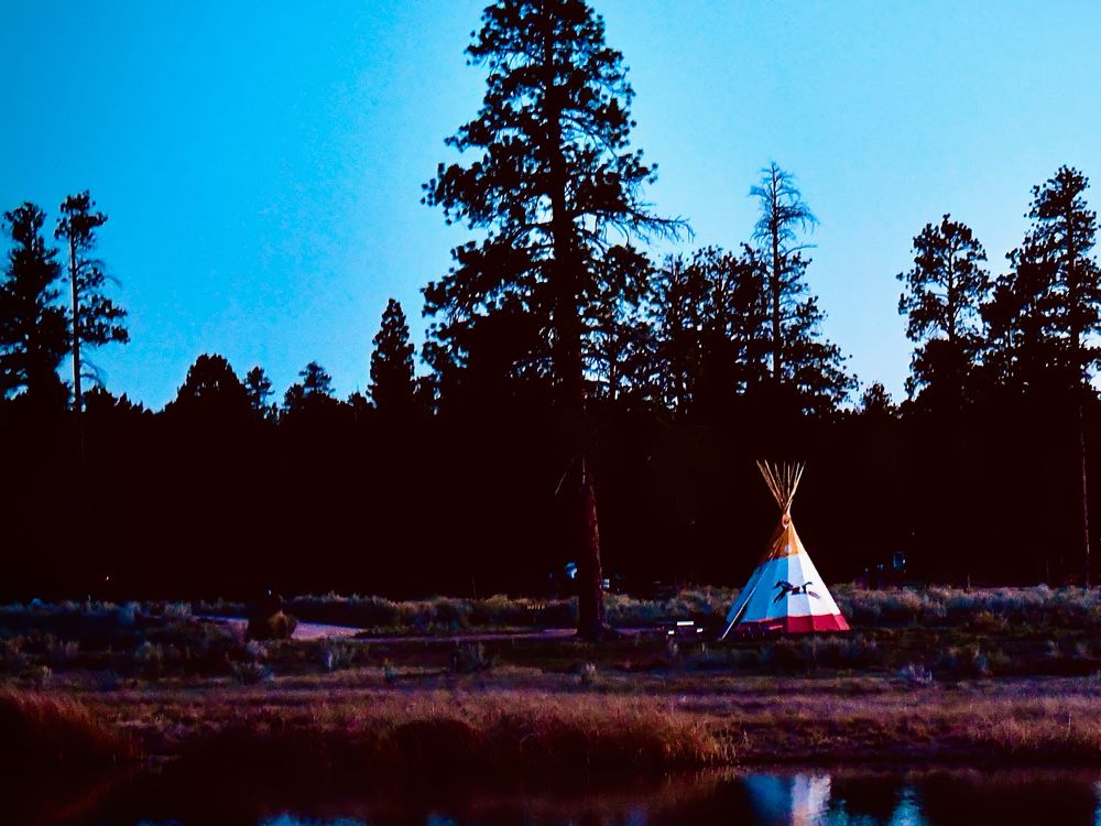 Nightfall and A Native American Teepee’s Reflection on The Lake ...