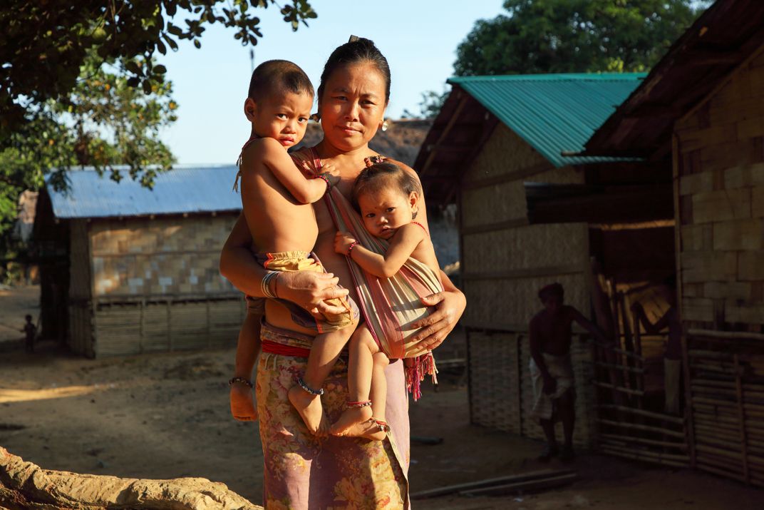 An indigenous Mro tribal woman and her grandchildren | Smithsonian ...