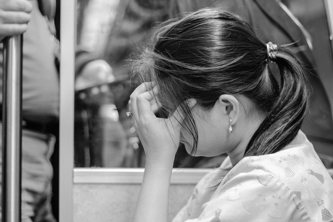 A photo of a woman I took before I noticed that she was crying on the ...
