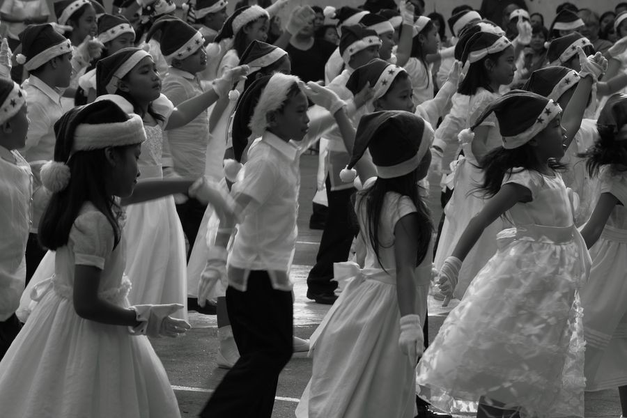 Watching a solemn Christmas dance performed by children of a Catholic ...