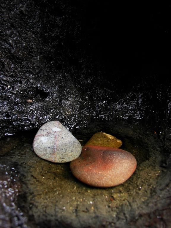 Small hole in a large rock made home to these rocks people have left at ...