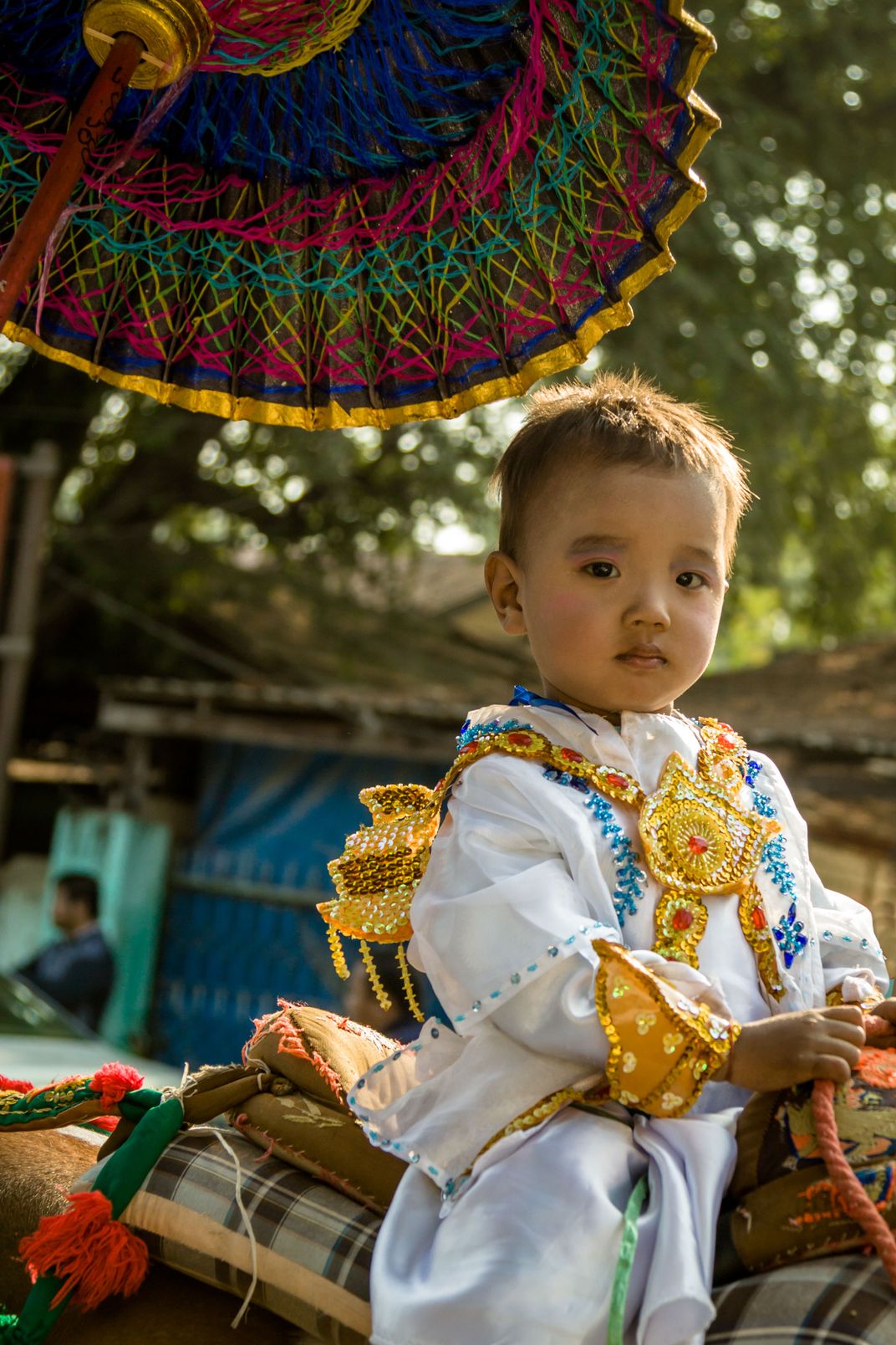 A girl during initiation ceremony is getting ready to become a monk ...
