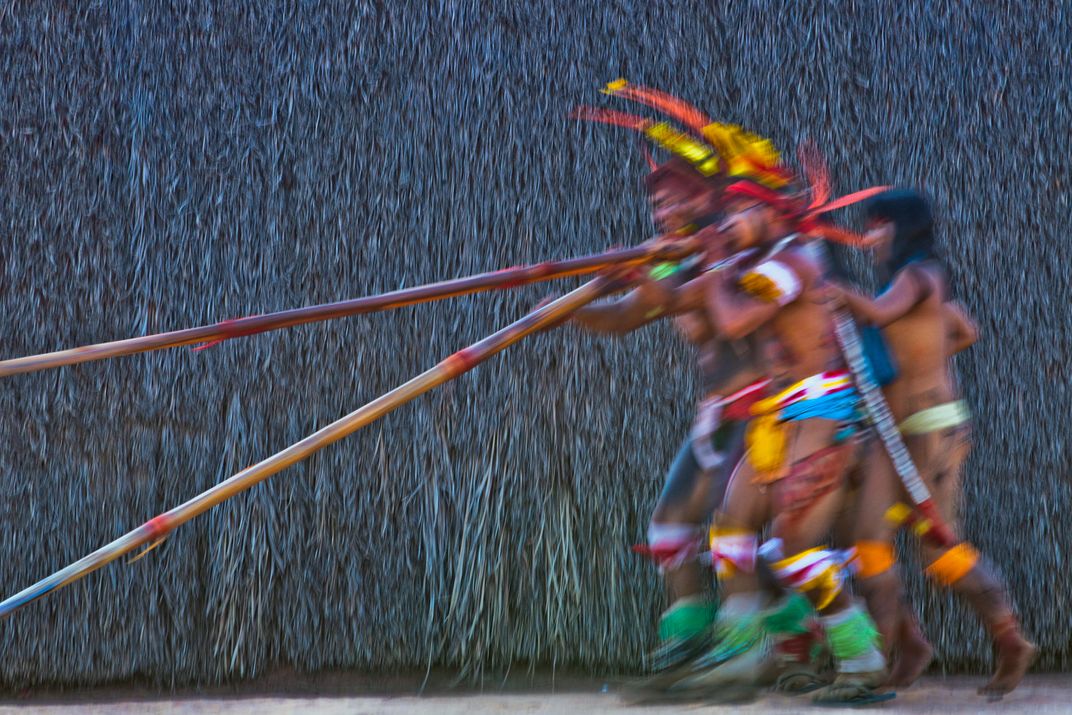 Indigenous play flutes during the celebration of the dead in the Xingu ...