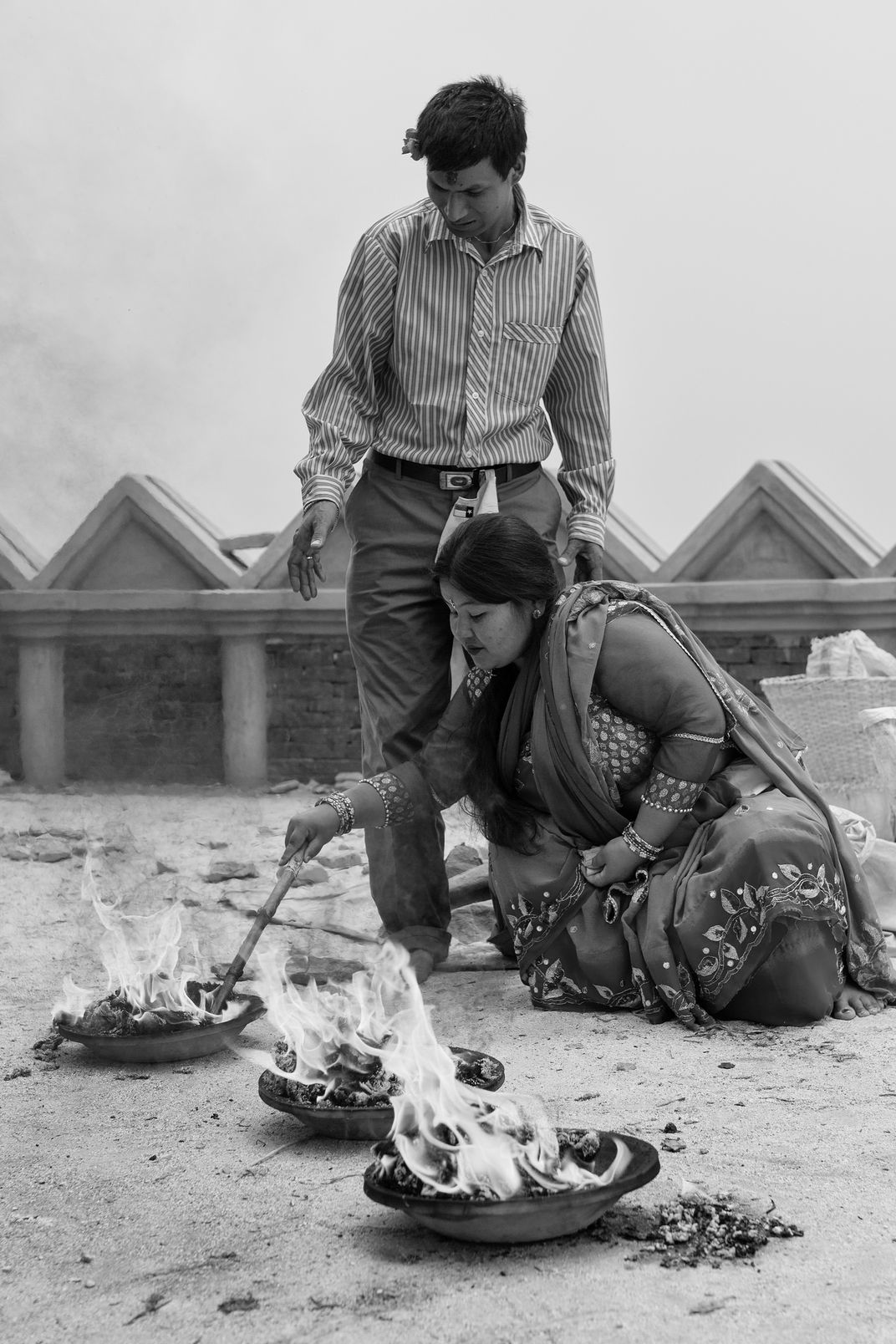 Nepali locals use fire in their prayers at Swayambhunath, Kathmandu ...