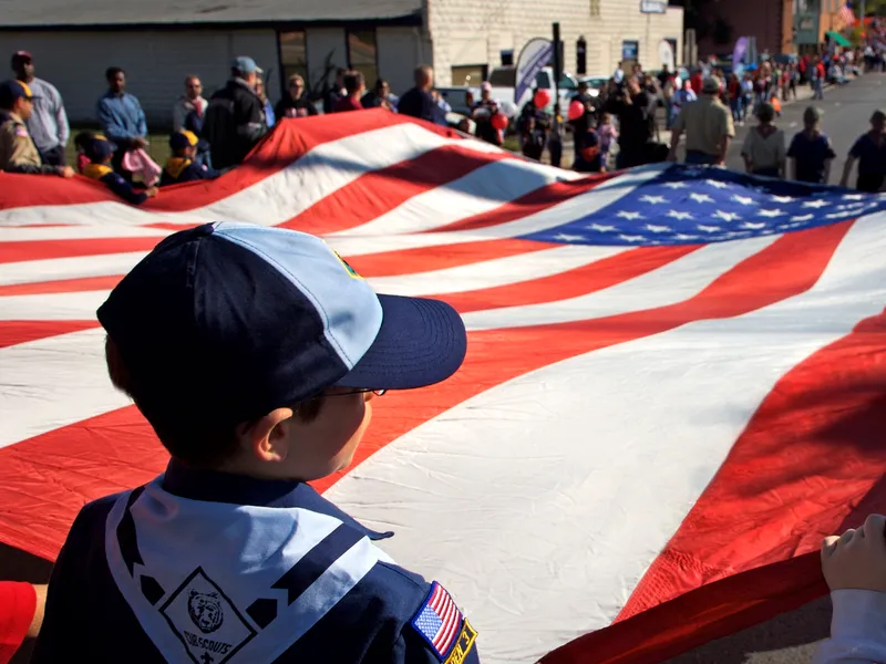 Boy Scouts carry the American flag in the Herndon Homecoming Parade ...