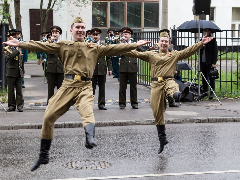Performance by a military dance group on a Moscow street near the house ...