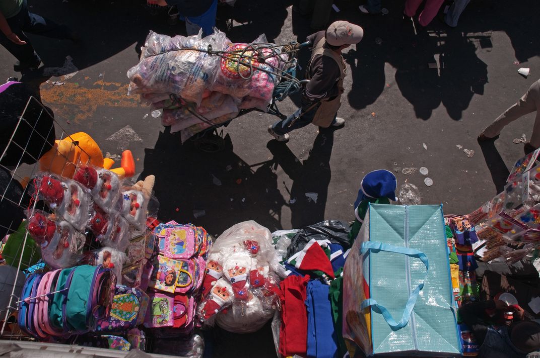 Birdseye view of person with cart at Sonora market in Mexico City ...